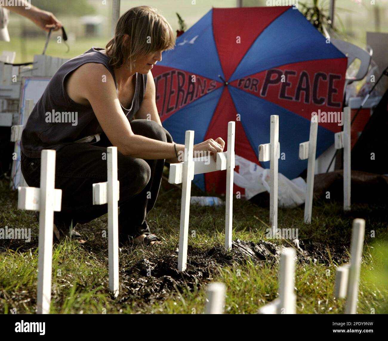 Lisa Fithian of Austin, Texas., places name tags of soldiers that were ...