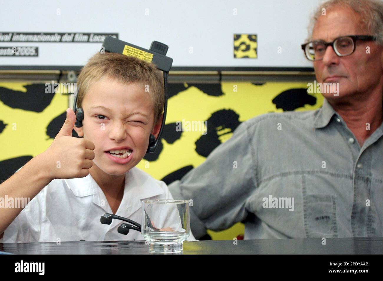 Italian child-actor Marco Grieco, left, grimaces for the photographers ...