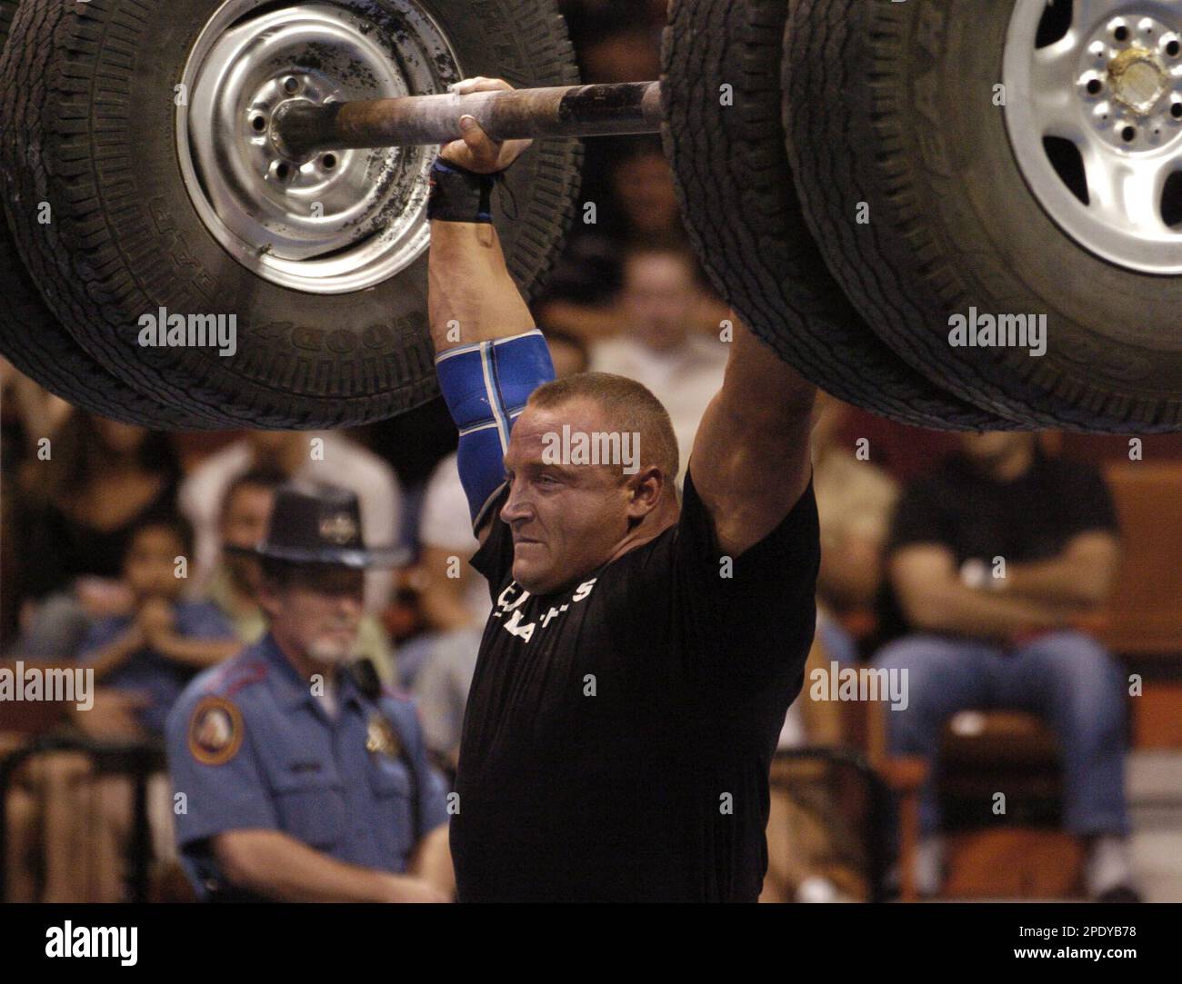 Mariusz Pudzianowski of Poland successfully lifts a 300-pound axle with ...