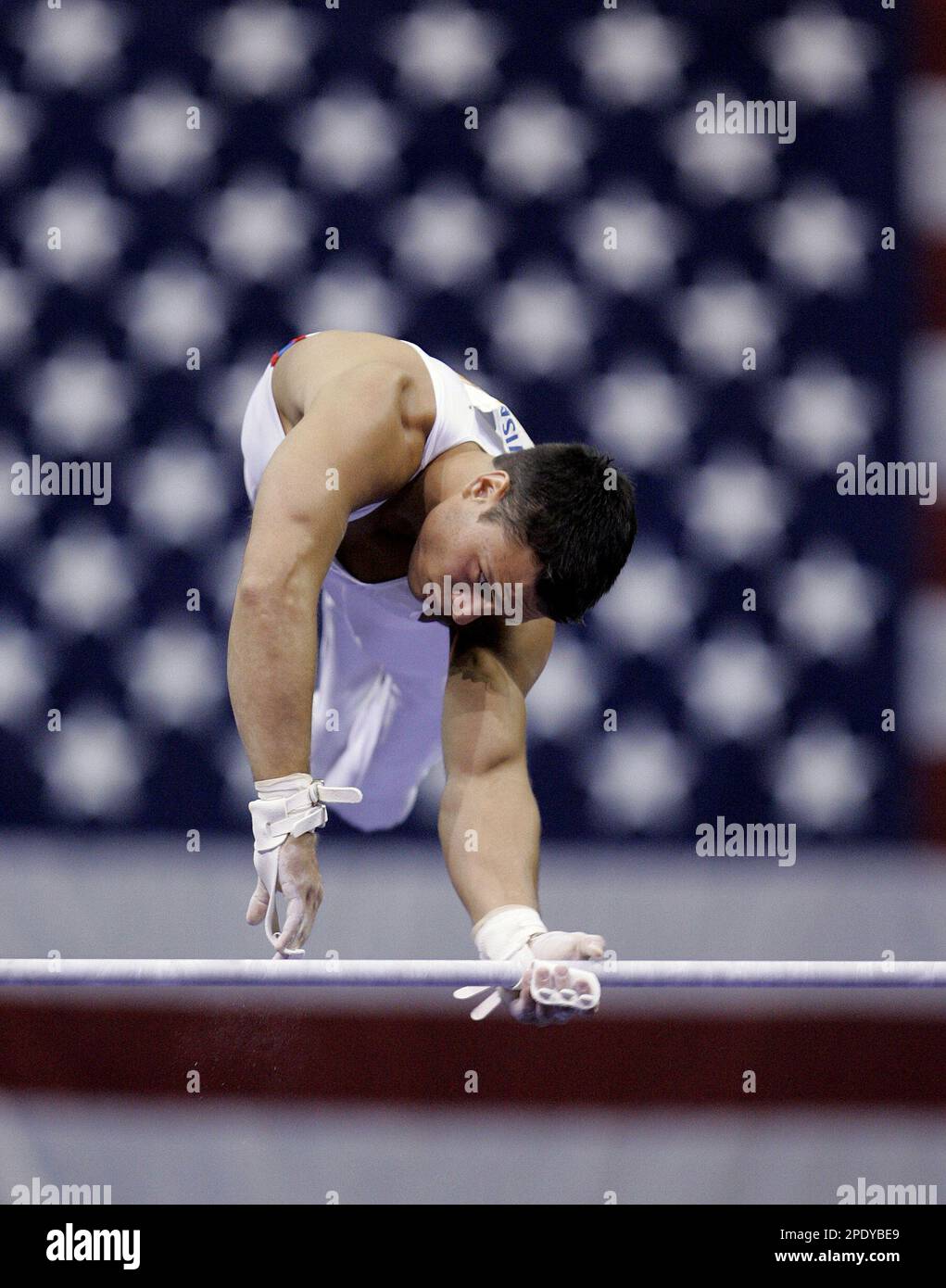Gymnast David Durante performs on the horizontal bar during the ...