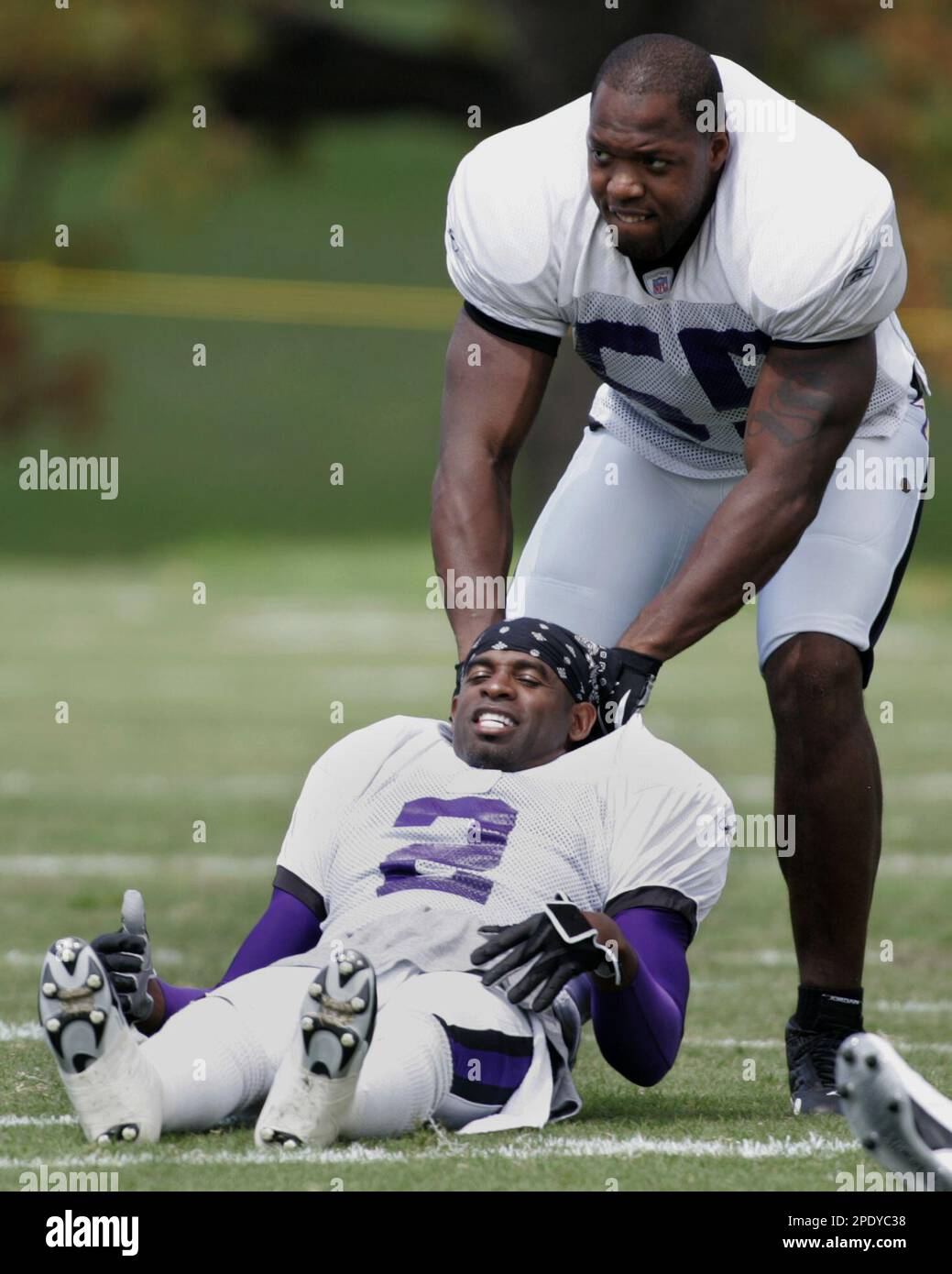 Baltimore Ravens linebacker Terrell Suggs, right, drags teammate Deion ...