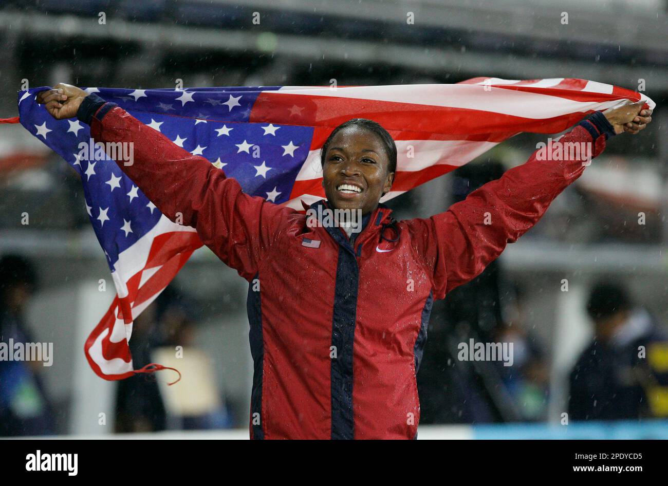 Tianna Madison carries the Stars and Stripes after winning the gold ...