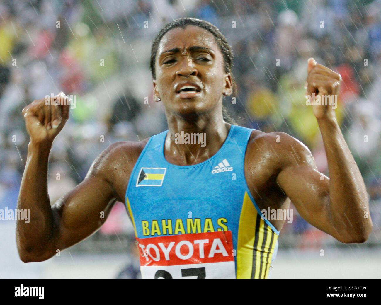 Tonique Williams-Darling of the Bahamas reacts in the pouring rain ...