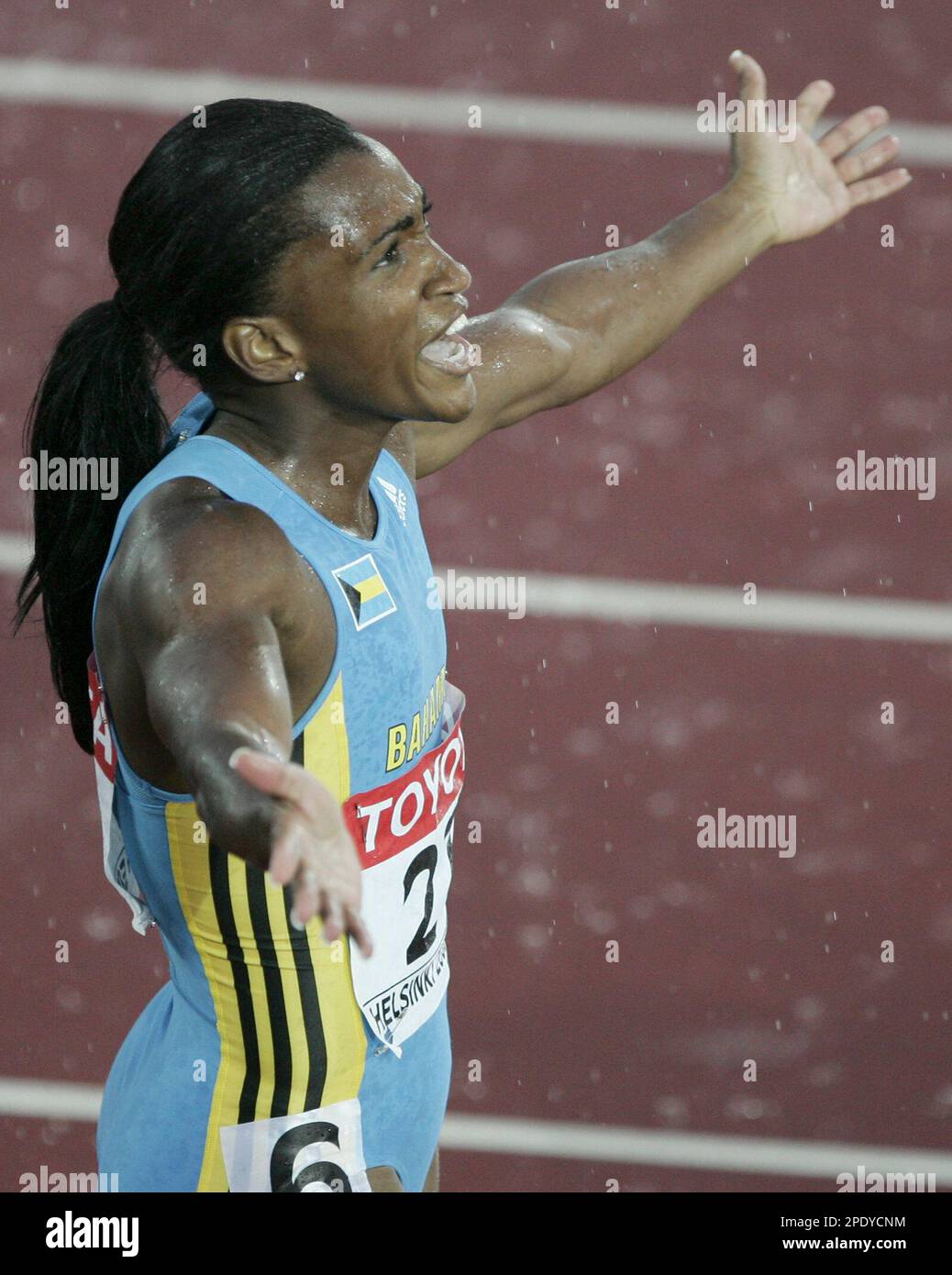 Tonique Williams-Darling of the Bahamas reacts in the pouring rain ...