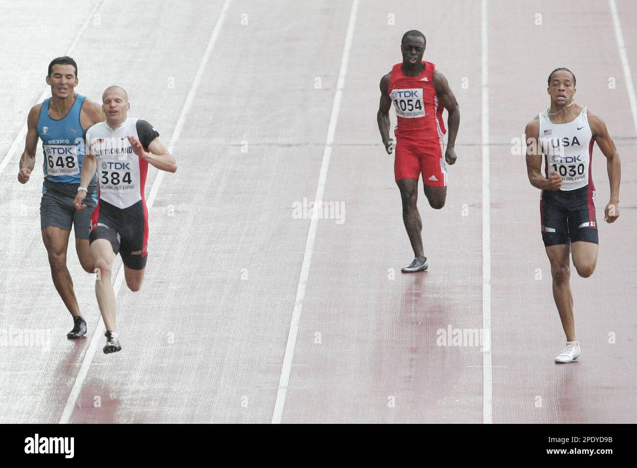Germany's Tobias Unger, second from left, heads for the line ahead of ...