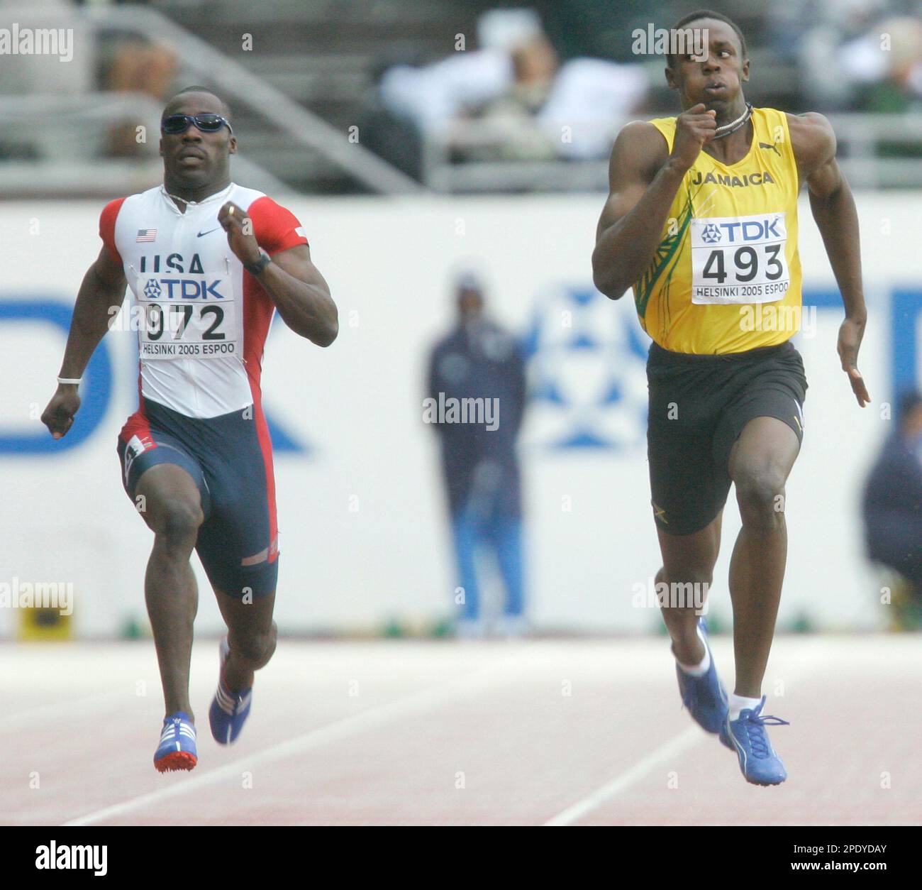 John Capel of the US, left, gets ahead of Jamaica's Usain Bolt, to win ...