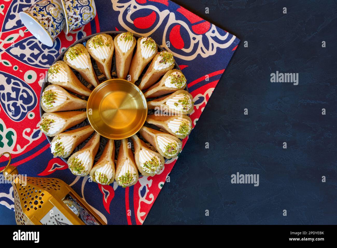 Arabian pancake Qatayef with qishta cream and pistachio . Traditional ...