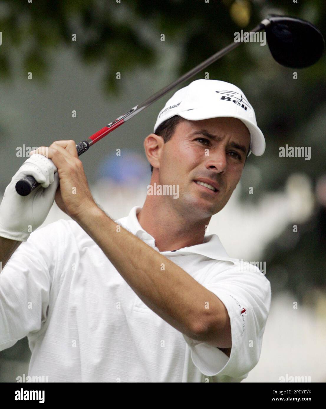 Mike Weir, of Canada, tees off on the practice range during practice ...