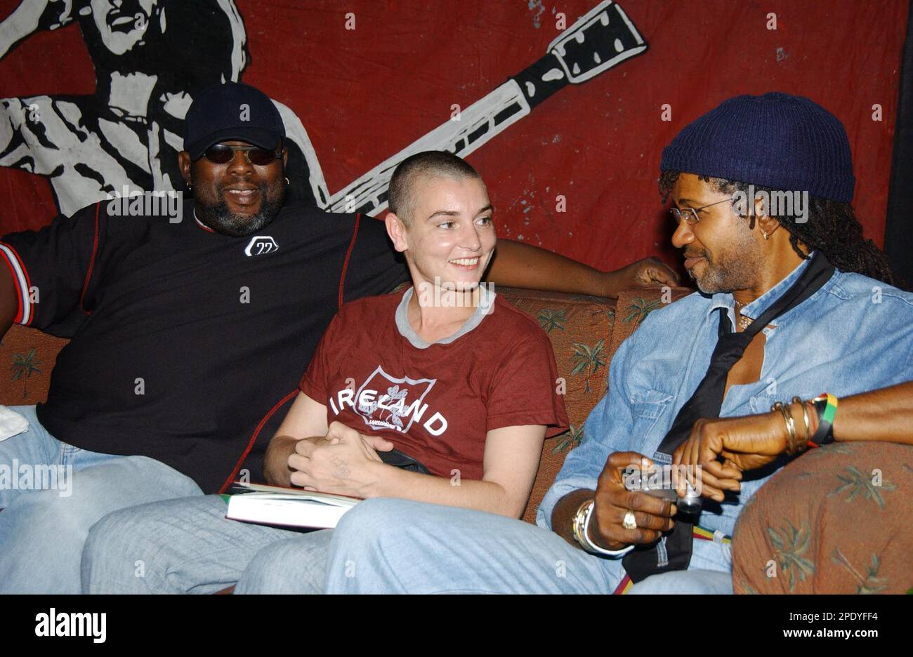 Irish pop singer Sinead O'Connor, center, chats with Sly Dunbar, right ...