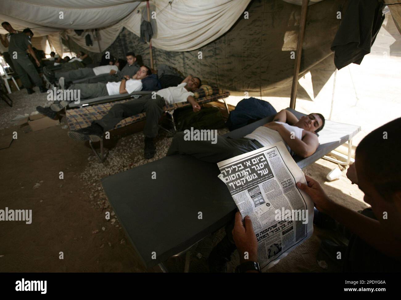 Israeli border police officers take some rest in their tent in southern ...