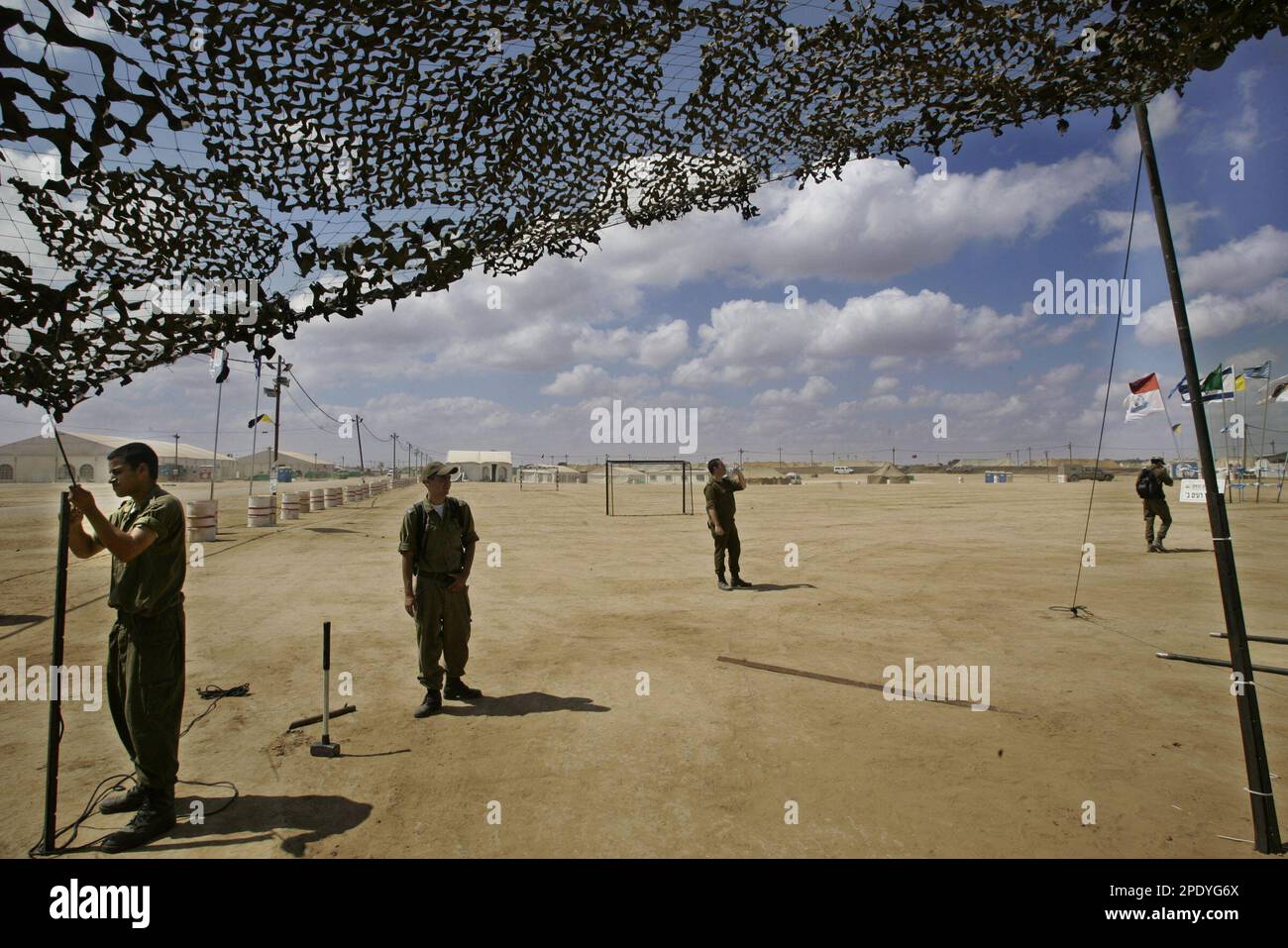 Israeli soldiers set up tents in southern Israel's massive Reim army ...