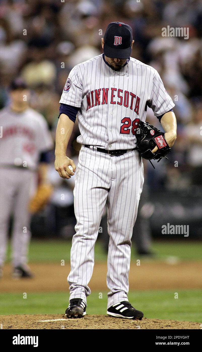 Minnesota Twins pitcher Jesse Crain looks down at the mound after ...