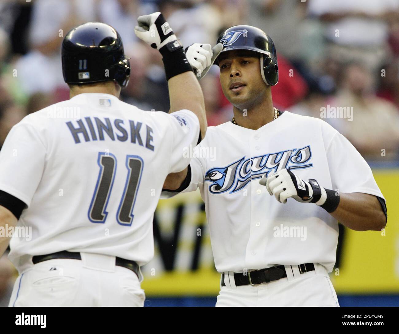 Toronto Blue Jays first baseman Eric Hinske congratulates teammate Alex ...