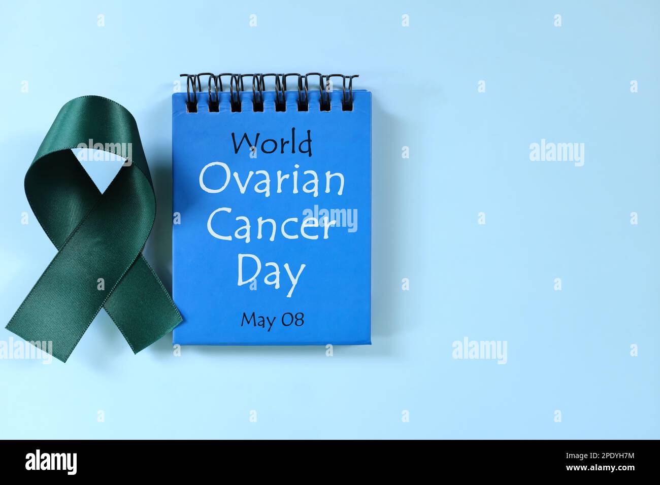 May 8 as World Ovarian Cancer Day date reminder on blue desk calendar ...