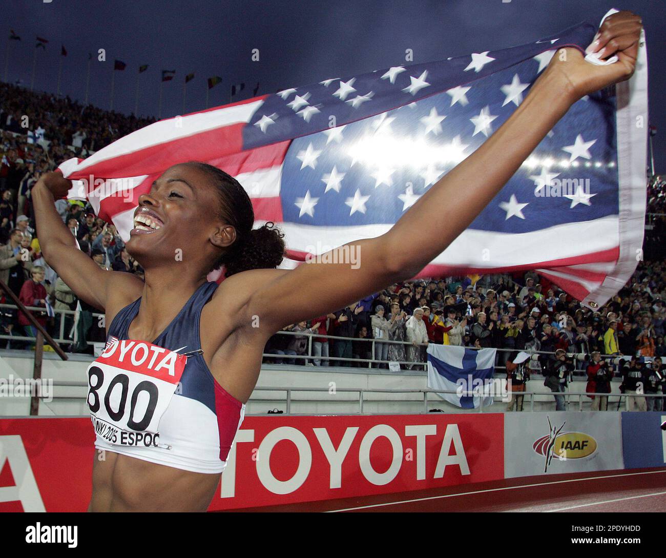 Chaunte Howard of the USA holds the Stars & Stripes as she celebrates ...