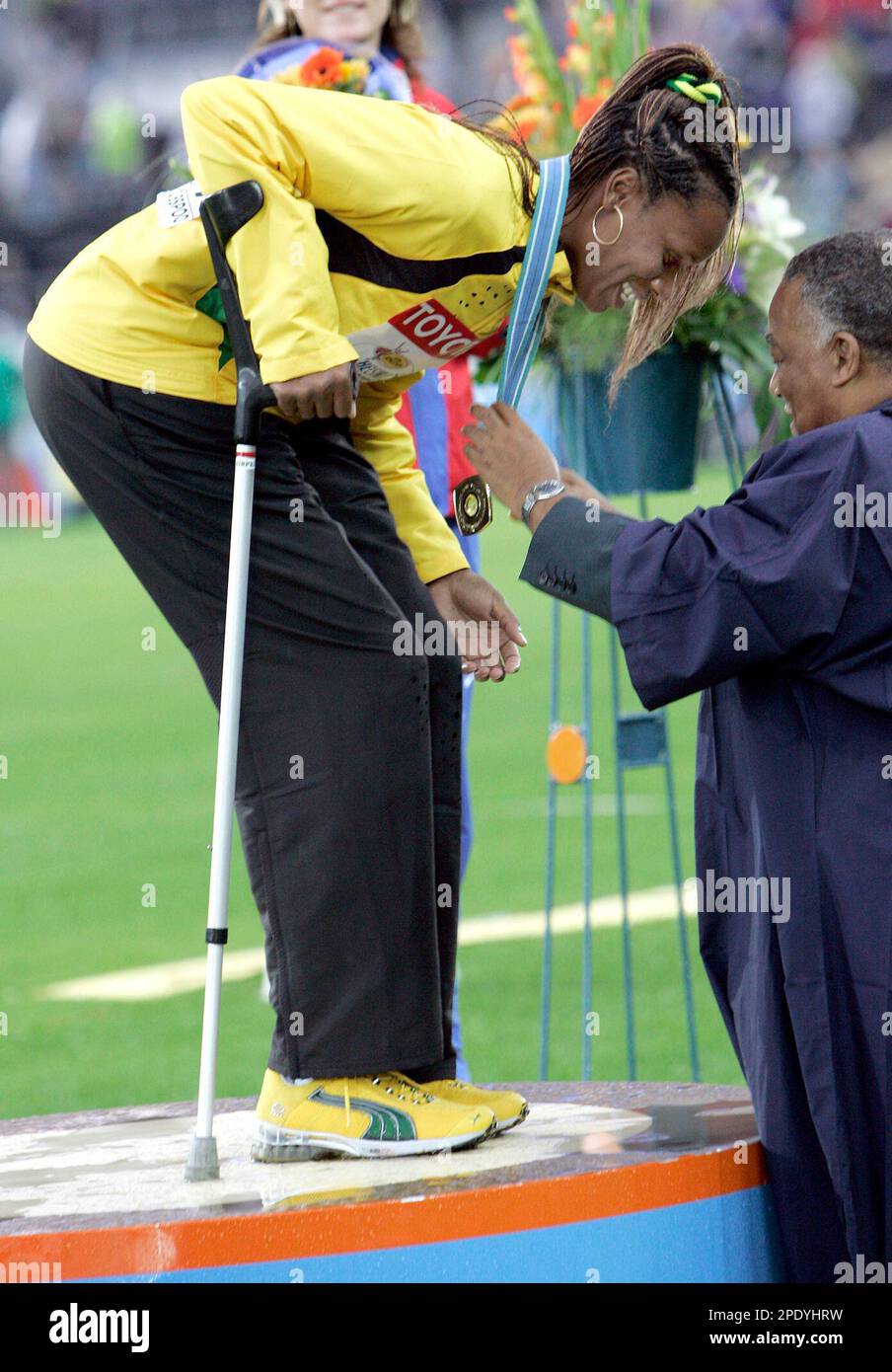 Jamaican gold medalist Trecia Smith receives her medal during a ...