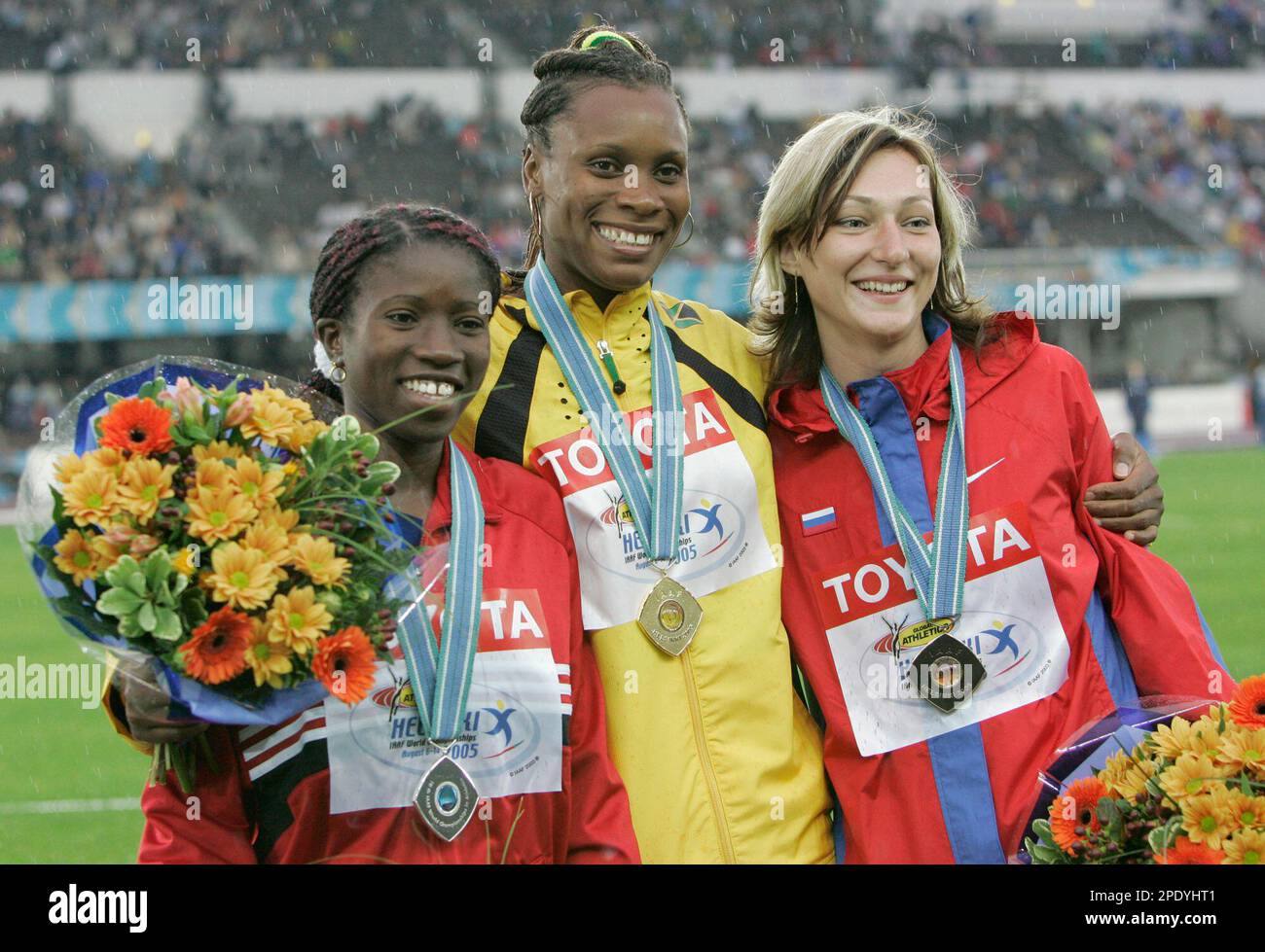 Jamaican gold medalist Trecia Smith, centre, Cuba's Yargelis Savigne ...