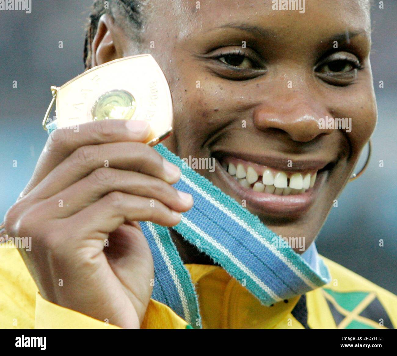 Jamaican gold medalist Trecia Smith poses with her medal following a ...