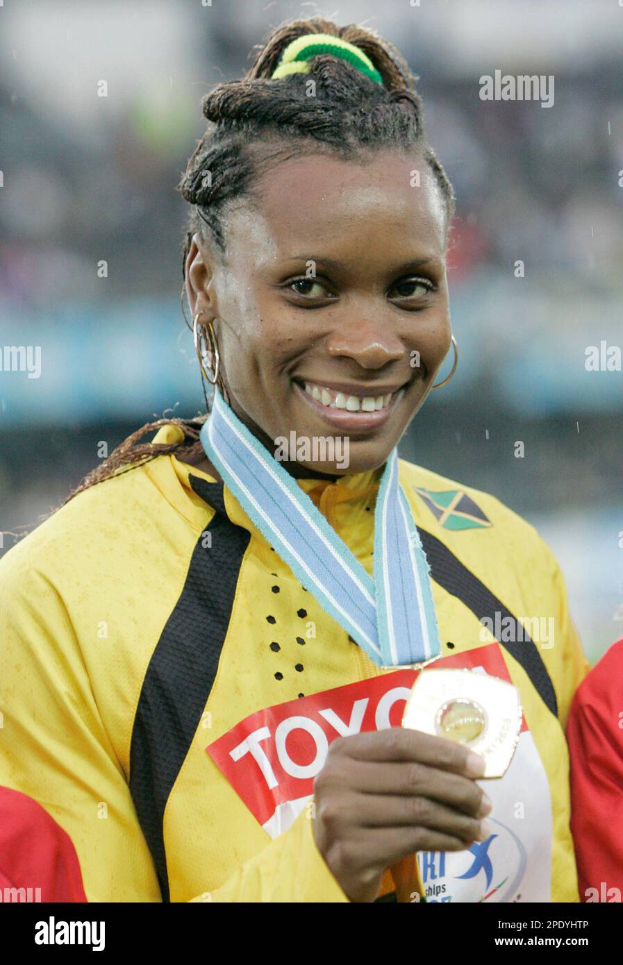 Jamaican gold medalist Trecia Smith poses with her medal following a ...