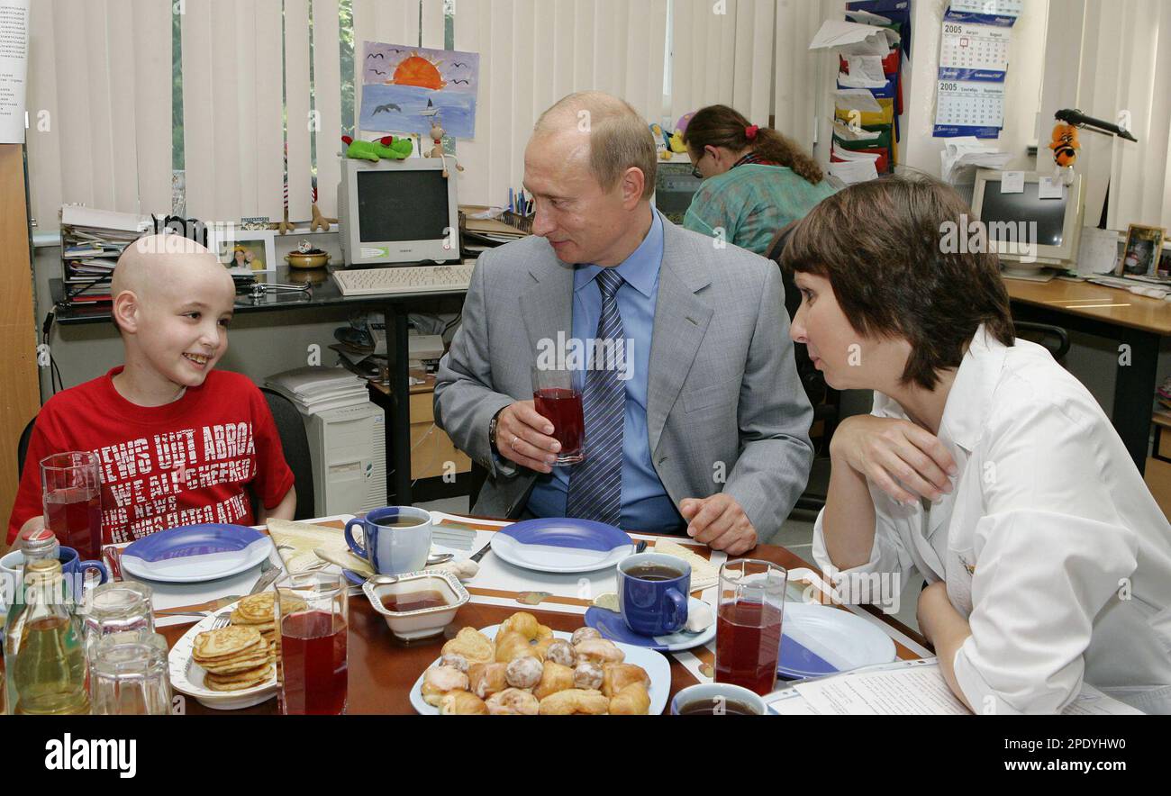 Russian President Vladimir Putin, speaks with Dmitry Rogachev, a 10-year-old patient of the ...