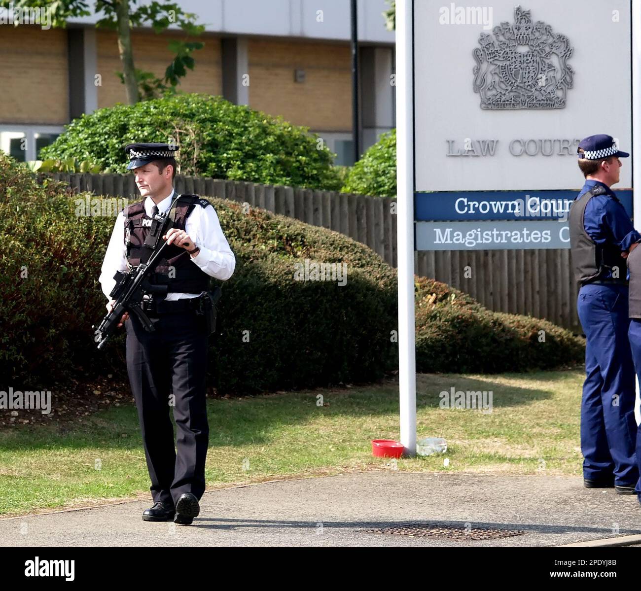 An armed British policeman stands guard outside the Belmarsh ...