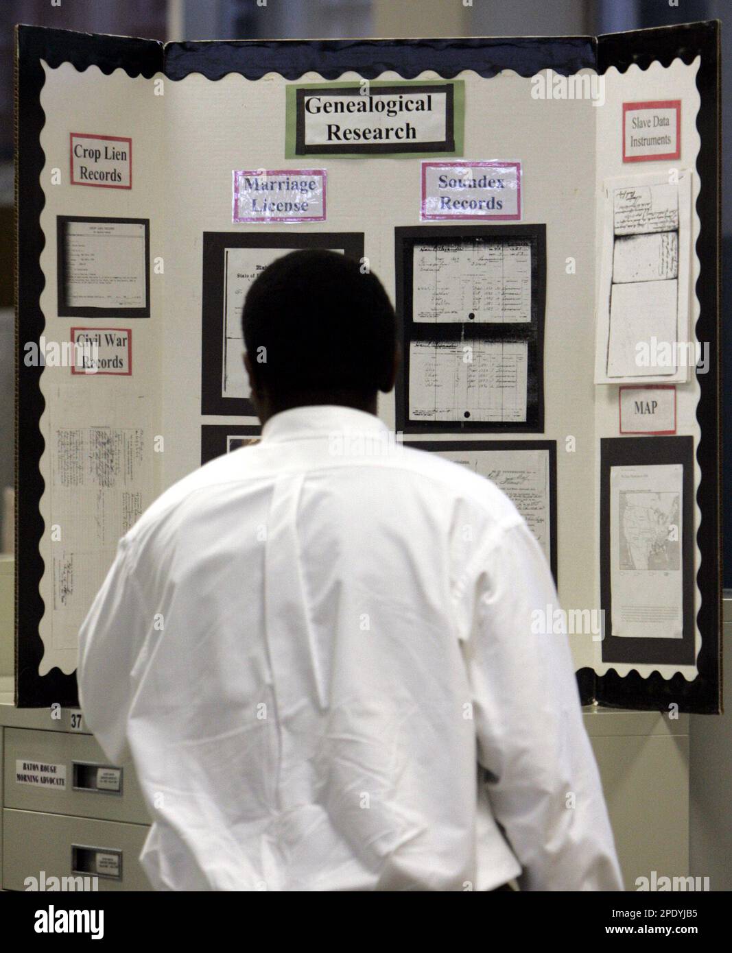 Wilbert Wilson looks at a display board about family history the New ...