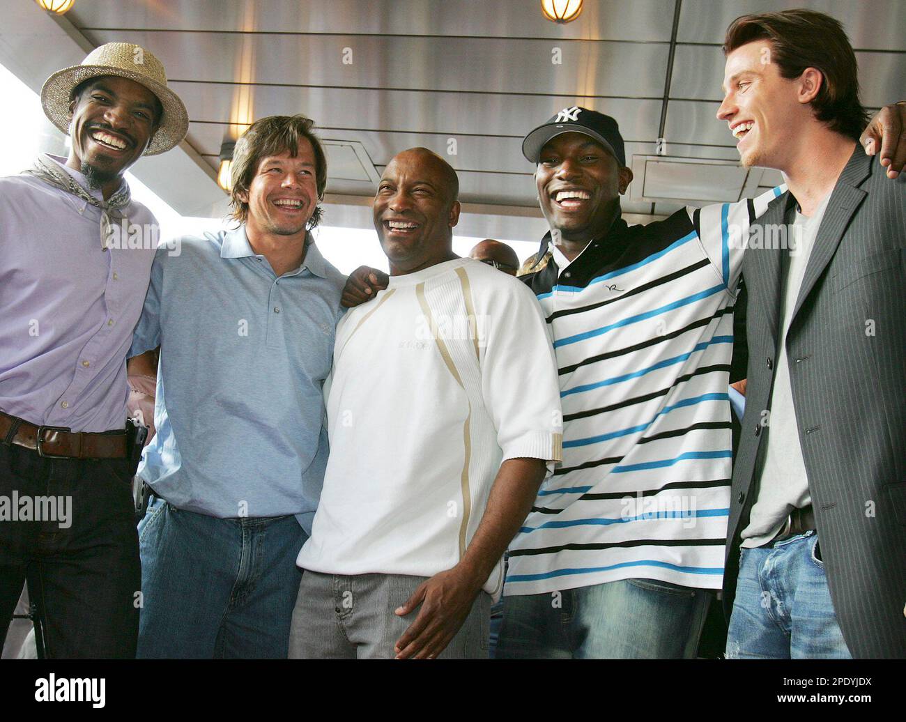 Director of the new film "Four Brothers," John Singleton, center, poses ...