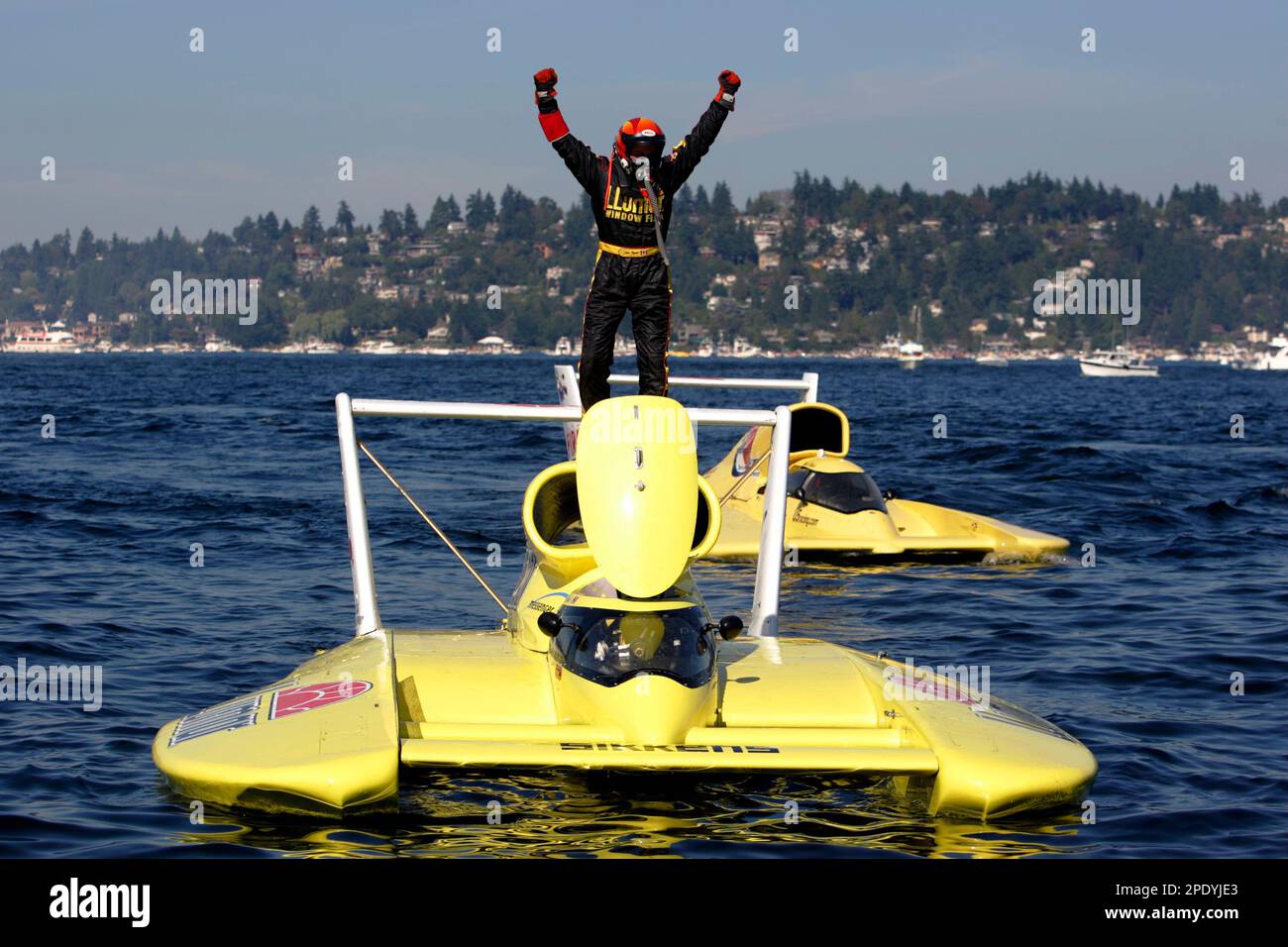 Miss Llumar driver Jean Theoret, of Maple Grove, Canada, stands on top ...
