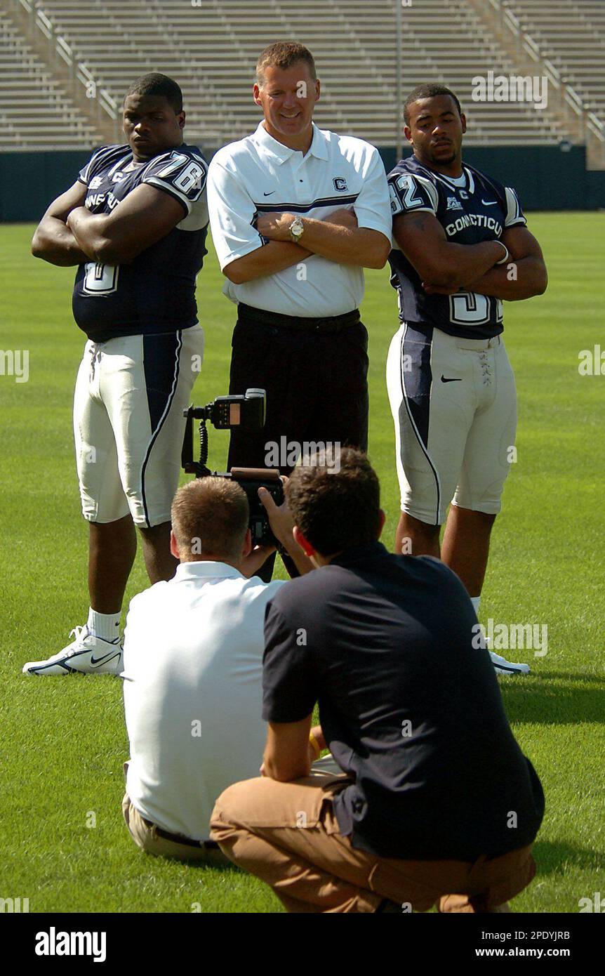 Connecticut football coach Randy Edsall, center, poses for a picture ...