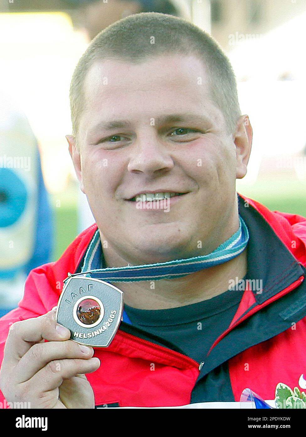 Germany's Ralf Bartels shows his bronze medal after the presentation ceremony for the Men's shot ...