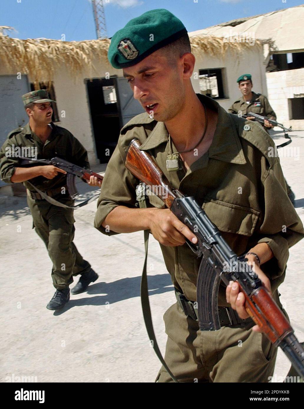 Palestinian police officers hold their rifles during a training session ...