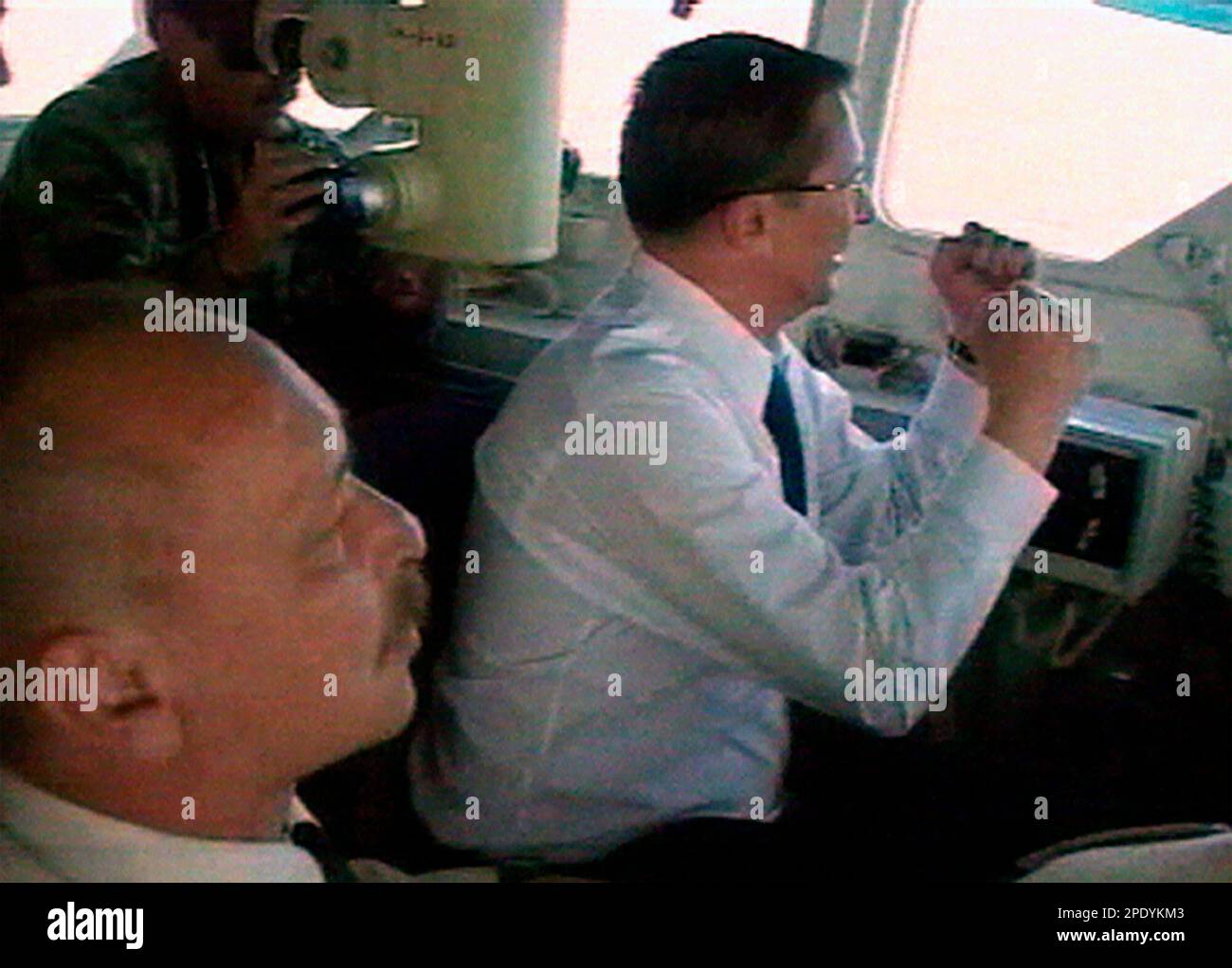 Russian Defence Minister Sergei Ivanov, right, reacts aboard a navy ...