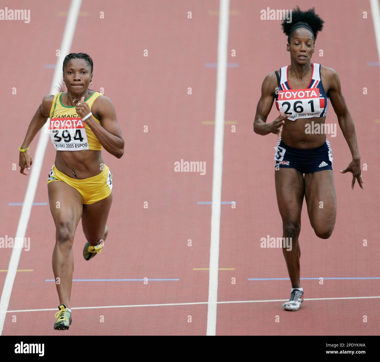 Aleen Bailey of Jamaica, left, heads for the line in front of Britain's ...
