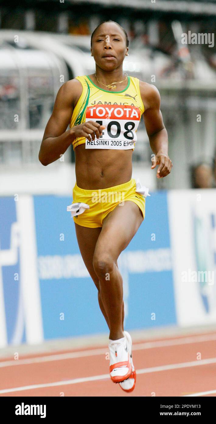 Jamaica's Sherone Simpson heads for the line to win the third heat of ...