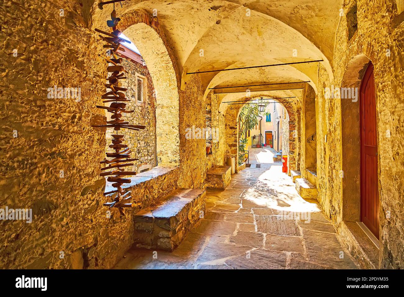 The covered vintage alleyway with rib-vaulted ceiling, arched windows ...