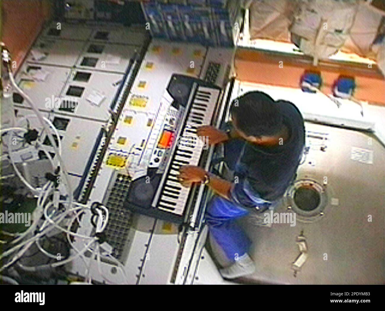 Japanese astronaut Soichi Noguchi plays his keyboard in this televised ...