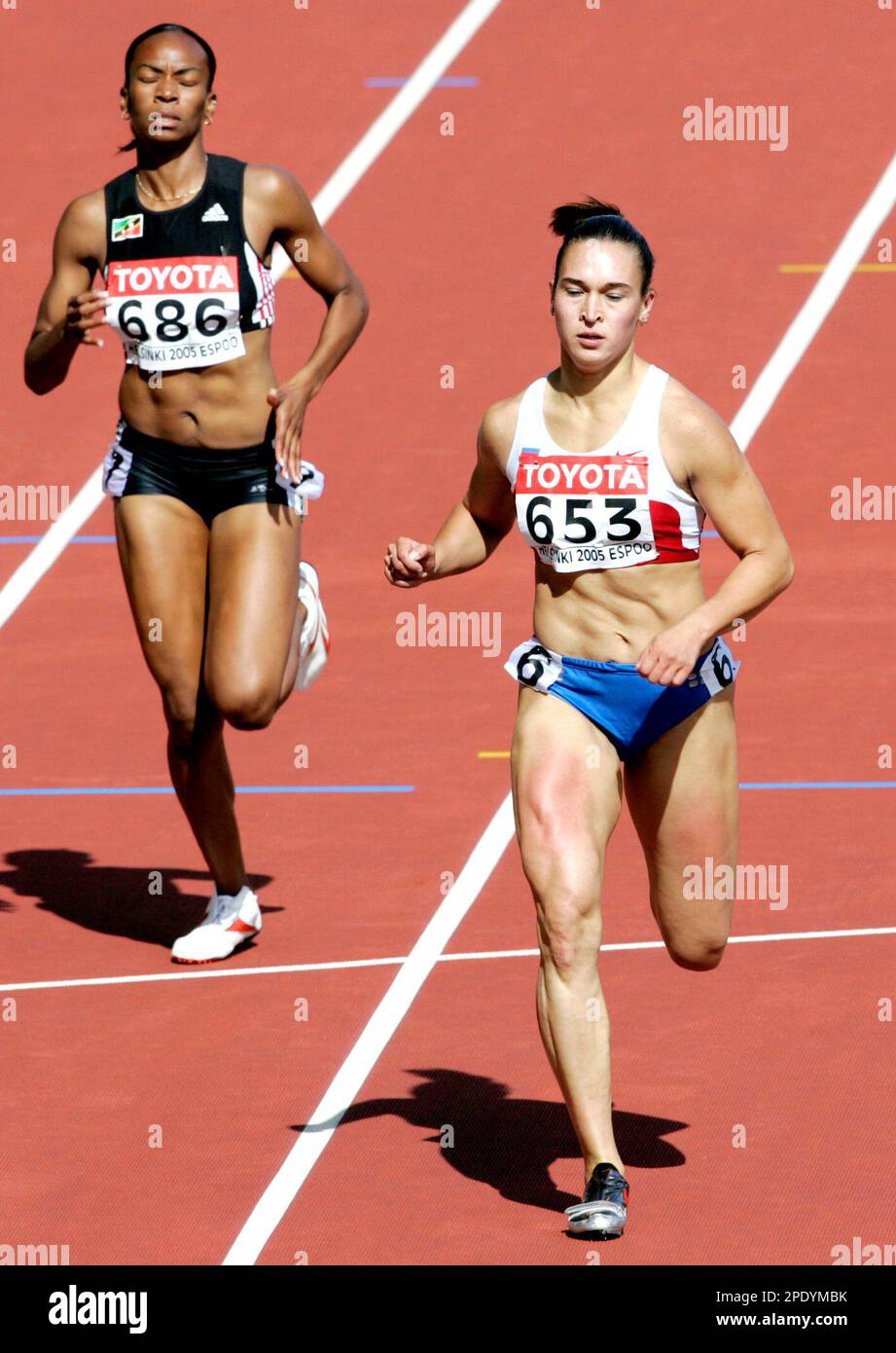 Russia's Svetlana Pospelova finishes ahead of Tiandra Ponteen of St. Kitts & Nevis, to win the ...