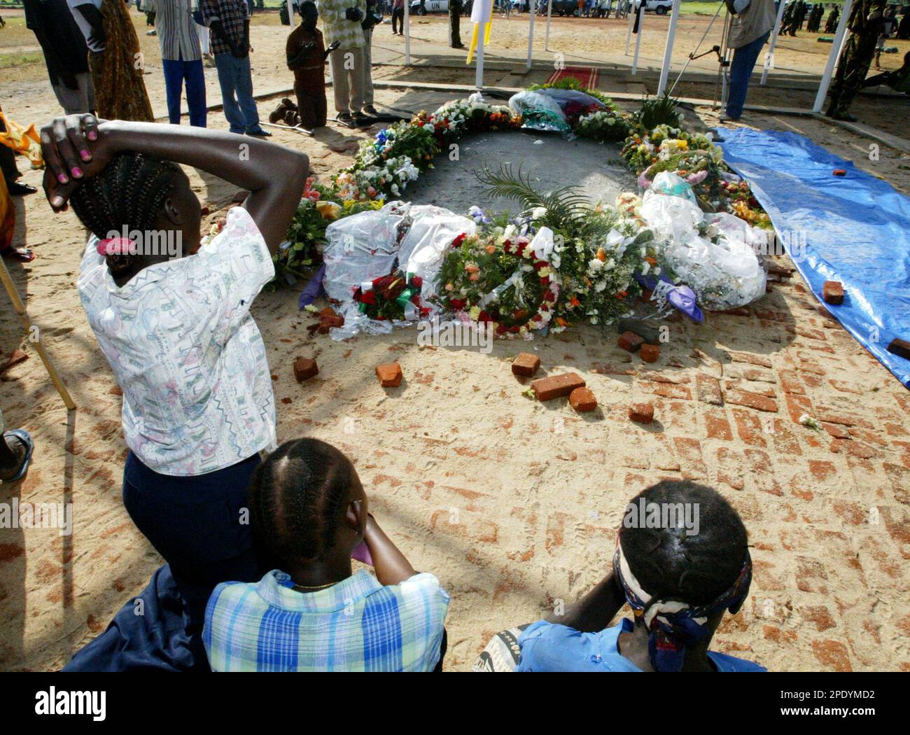 Supporters of the Sudan People's Liberation Movement pray at the tomb ...
