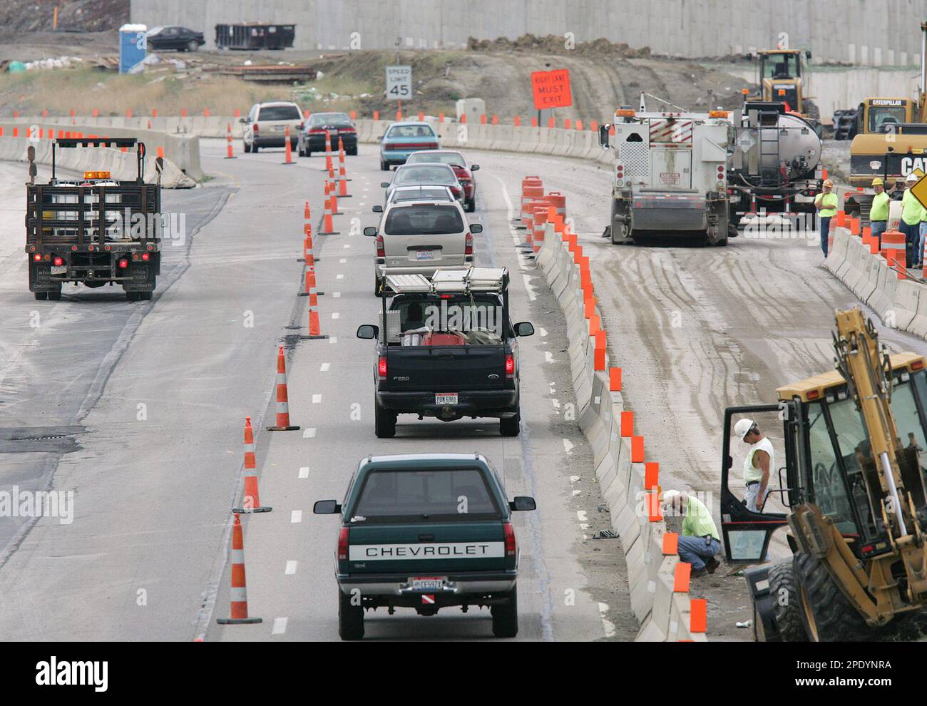 Workers along State Route 161 repair parts of the road Saturday, Aug. 6 ...
