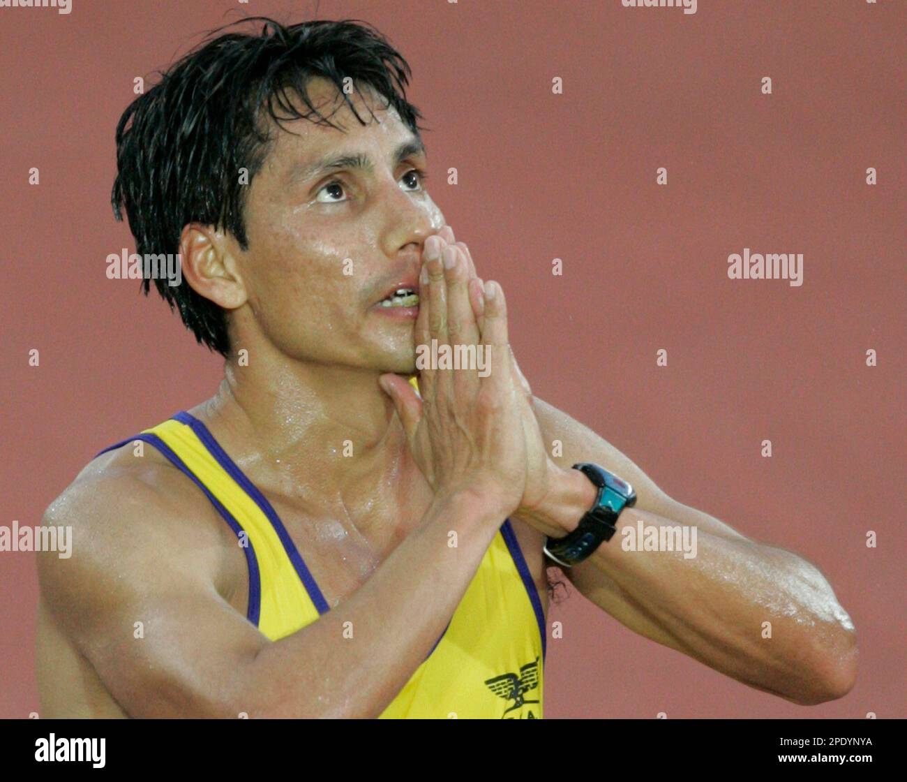 Jefferson Perez of Ecuador reacts after crossing the line to win the ...