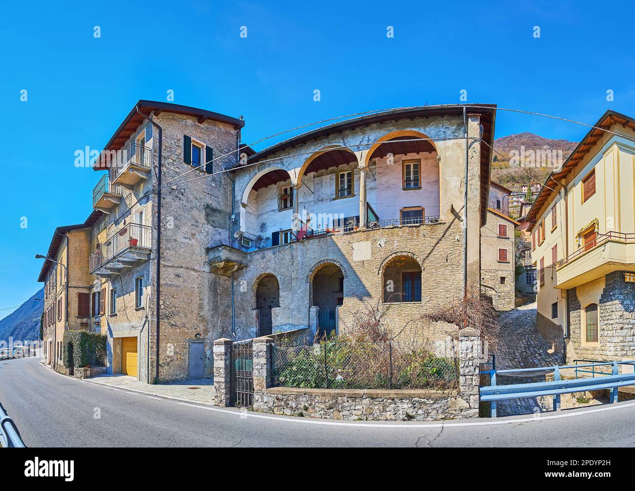 The line of historic townhouses and medieval mansions on embankment of ...