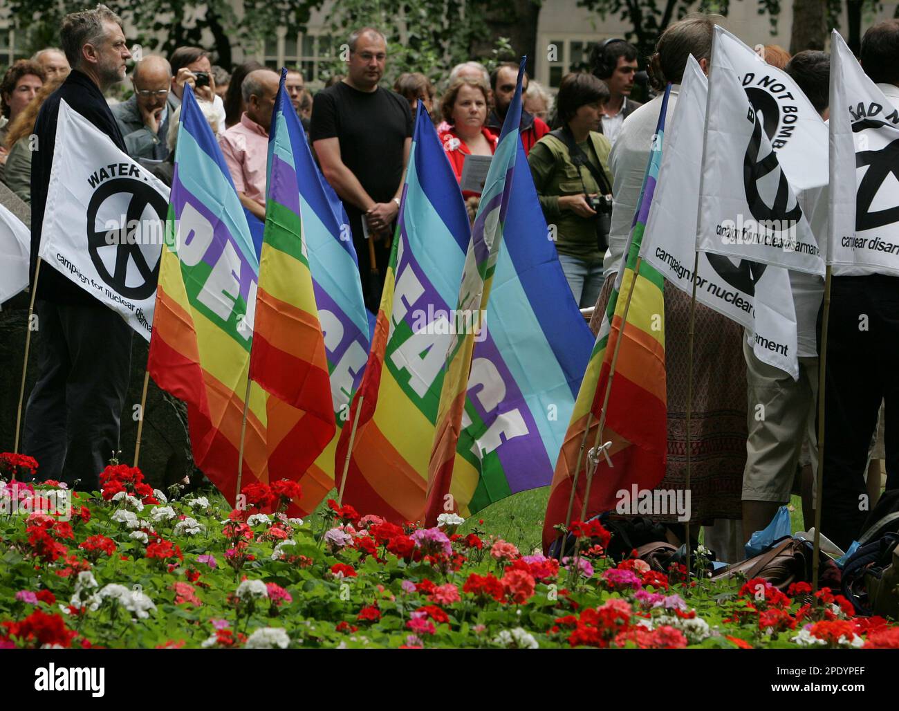 People gathered behind peace and CND flags, at a memorial ceremony in ...