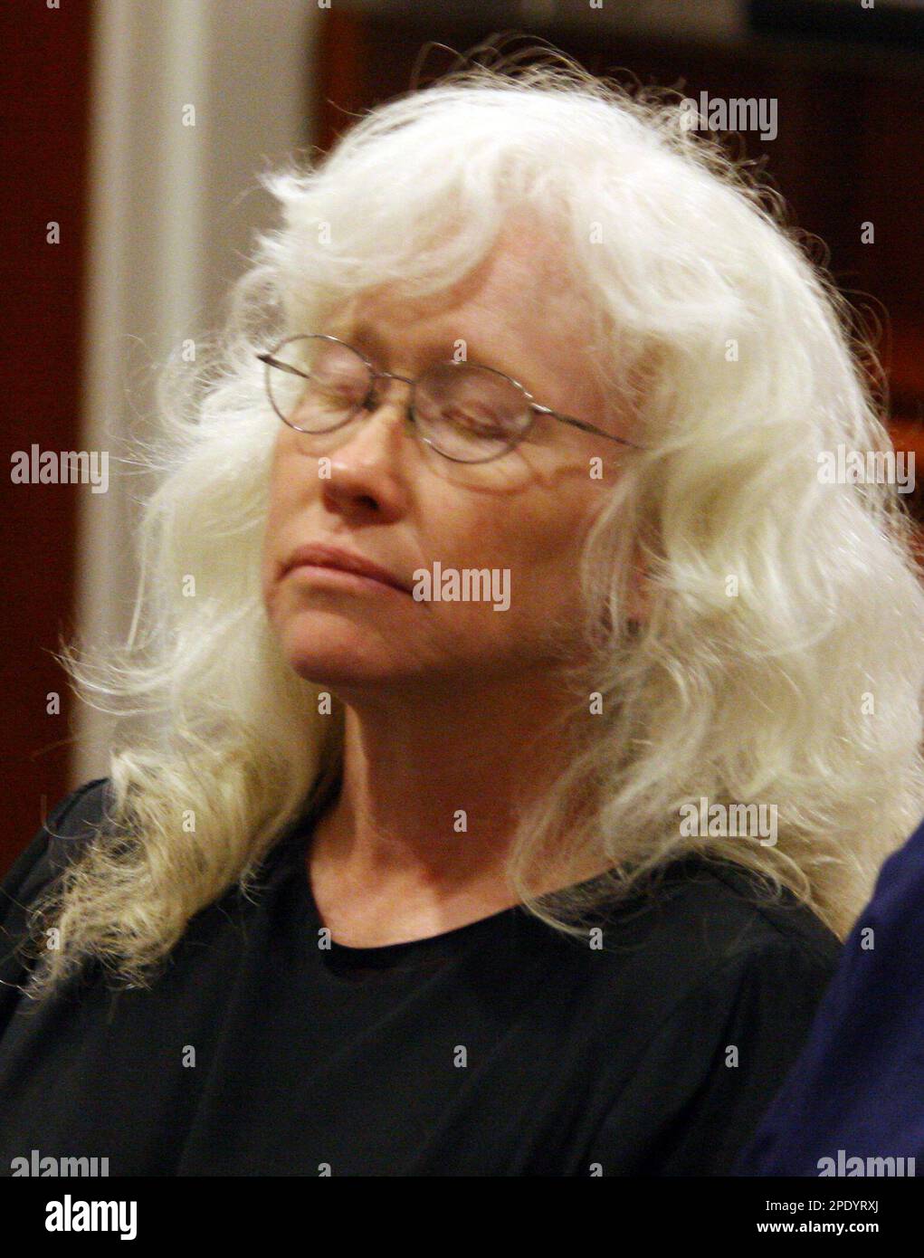 Mary Sloan, mother of victim Eric Nesbitt, reacts as jurors conclude ...