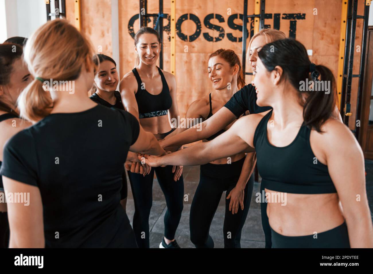 Taking a break. Group of young sportive people have crossfit day ...