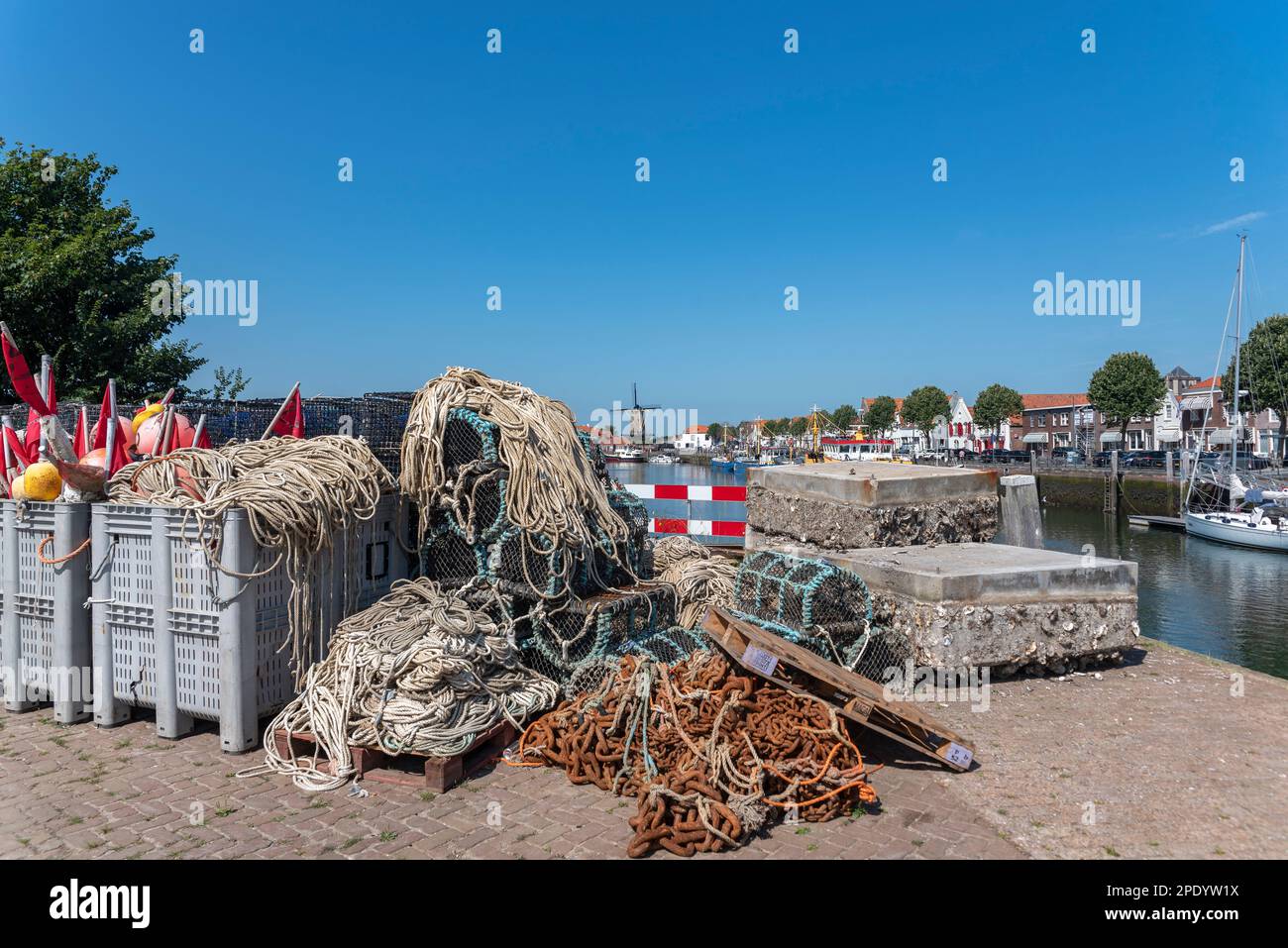 Fish traps, ropes and buoys at the quay Nieuwe Haven, in the background ...