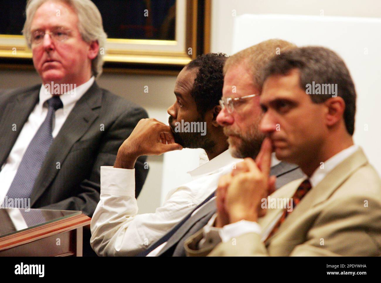 Daryl Atkins, second left, sits with his defense attorneys, Mark Oliver ...