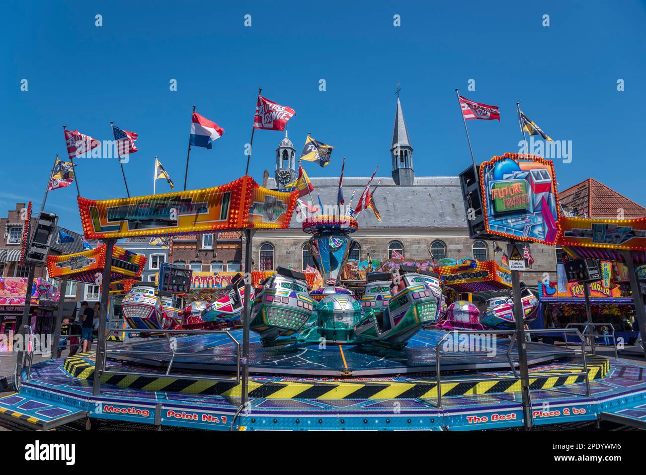 Carousel in front of the historic Gasthuiskerk at Havenplein, Zierikzee ...