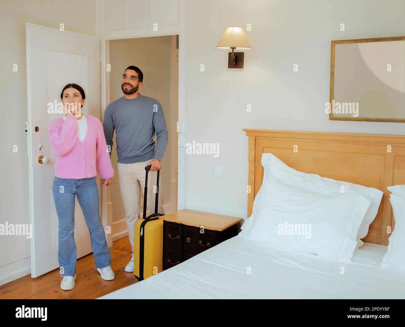 Couple entering bedroom hi-res stock photography and images - Alamy