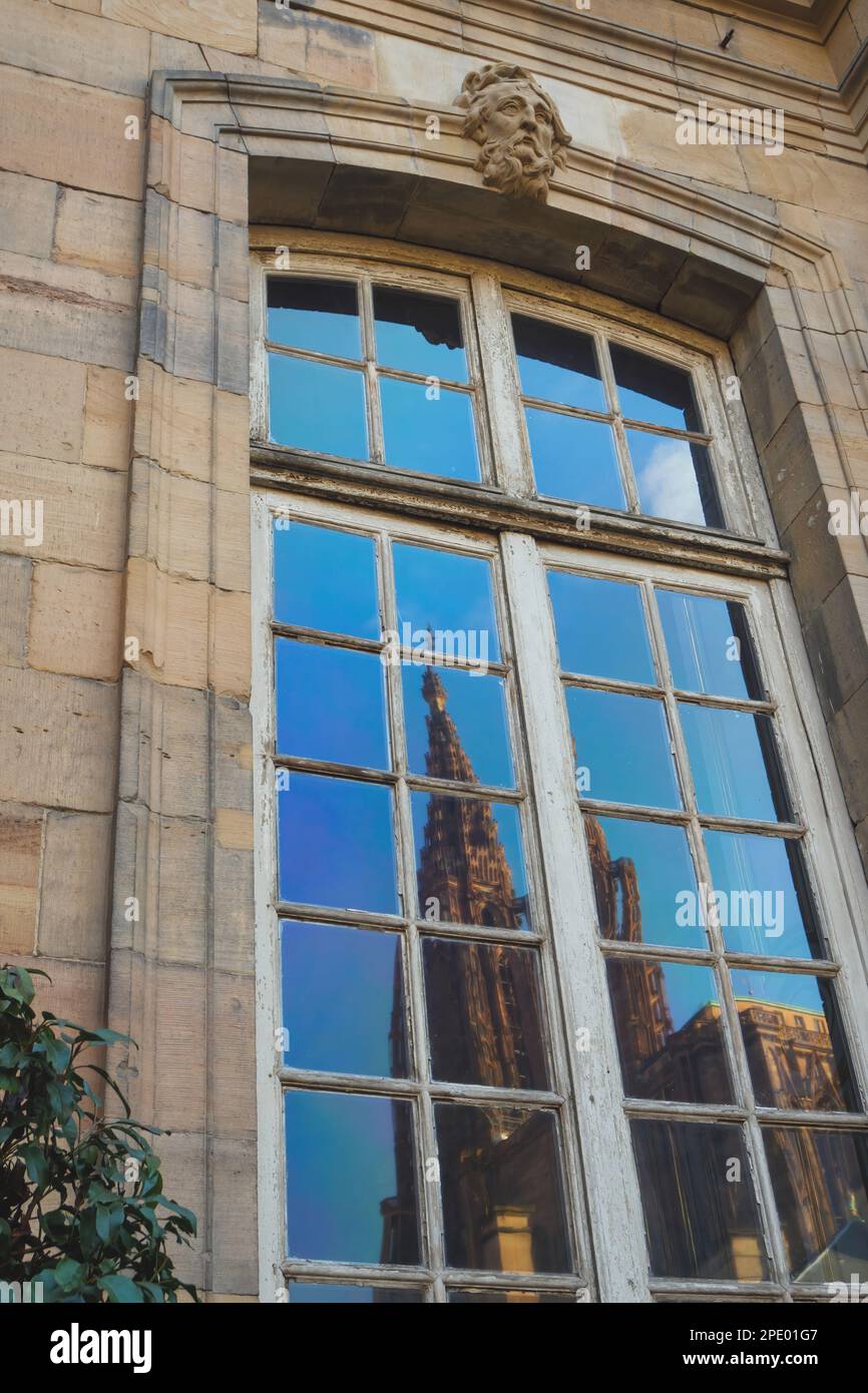 The blue stone facade with of an urban building stands tall in the ...