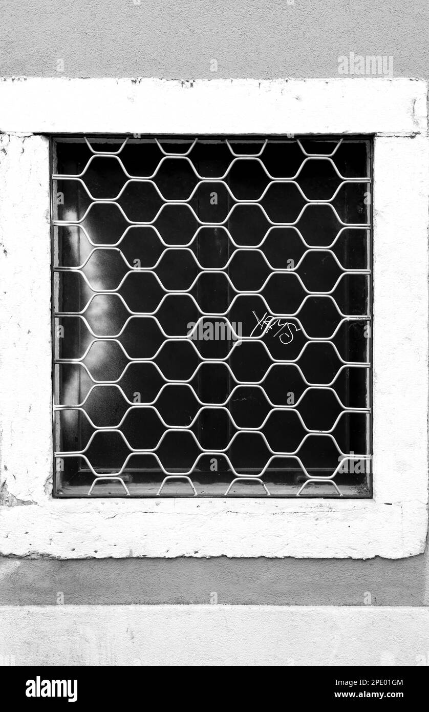 Window with metalized abstract and symmetrical grid texture Stock Photo ...
